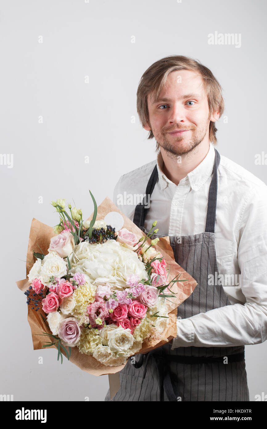 beautiful bouquet made of different flowers in young man hand ...