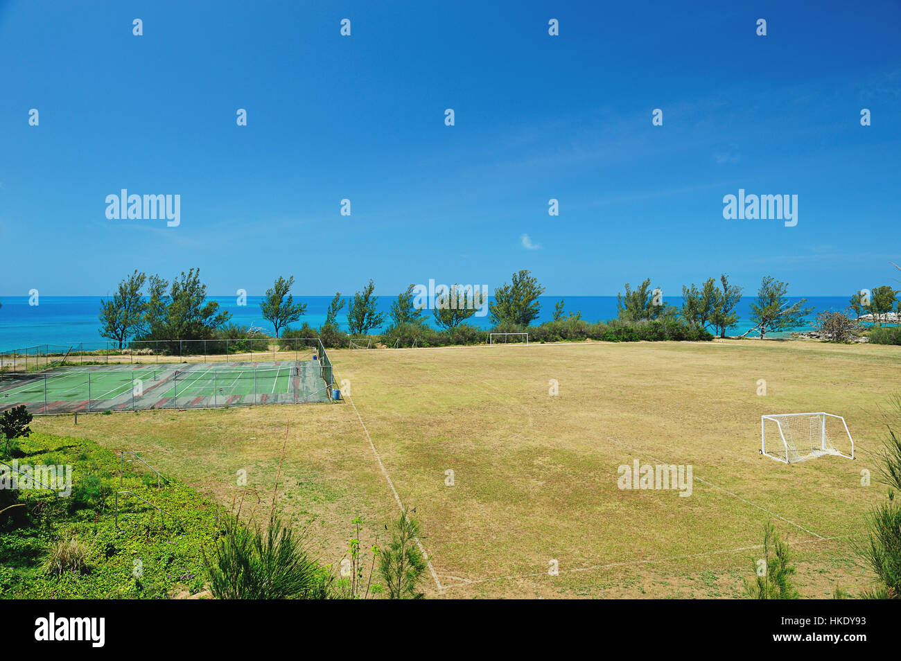Sport field next to sea in Bermuda island Stock Photo - Alamy