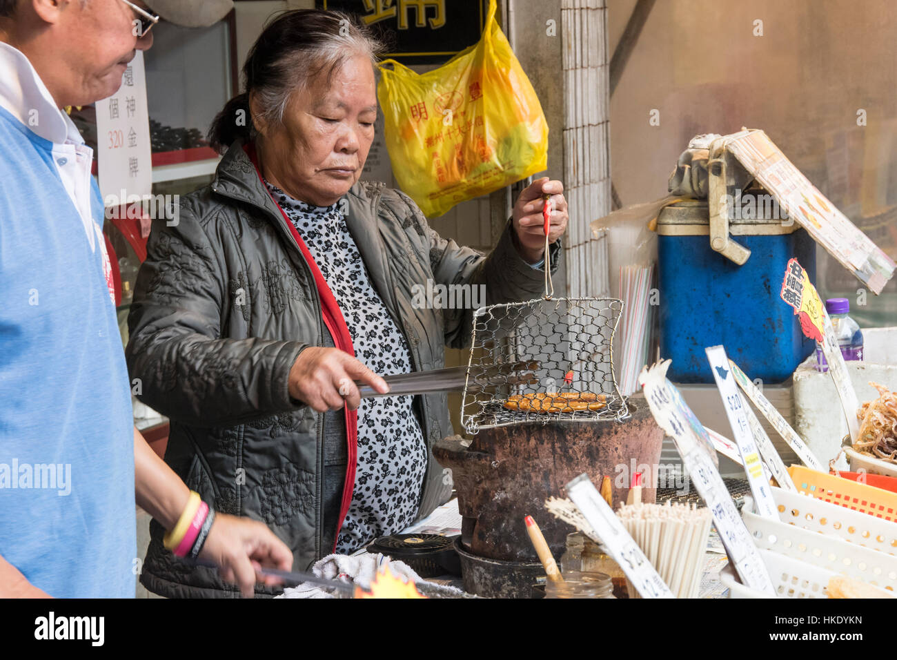 Traditional food preparation in the streets of Tai O, Hong Kong Stock ...