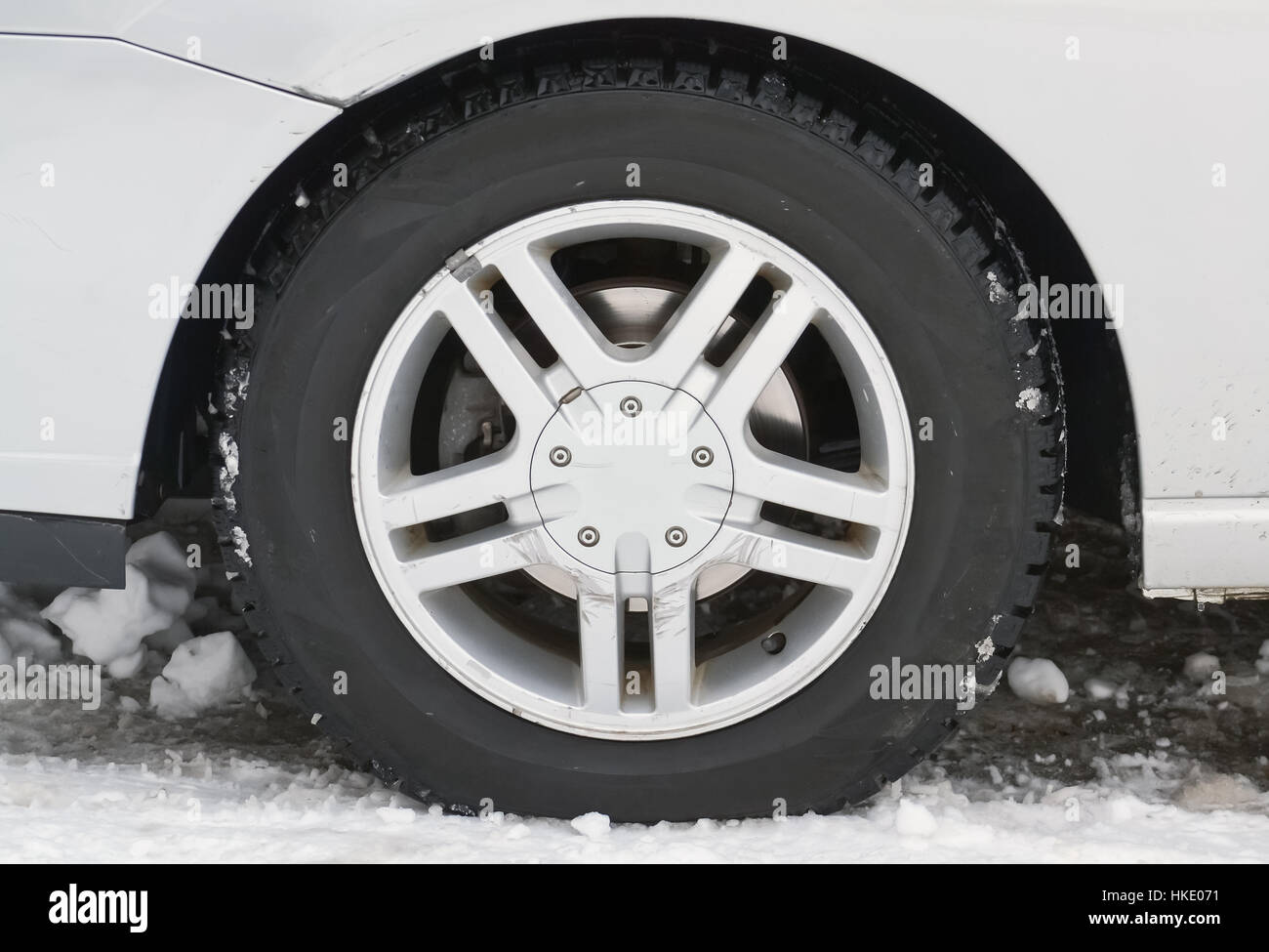 Closeup of a new winter tire in a cold snowy day Stock Photo - Alamy