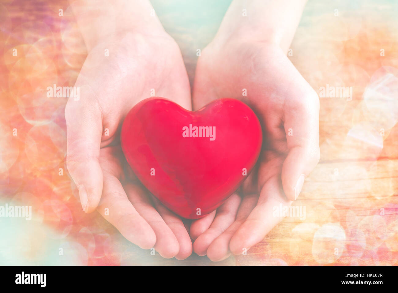 with heart in hands Stock Photo - Alamy