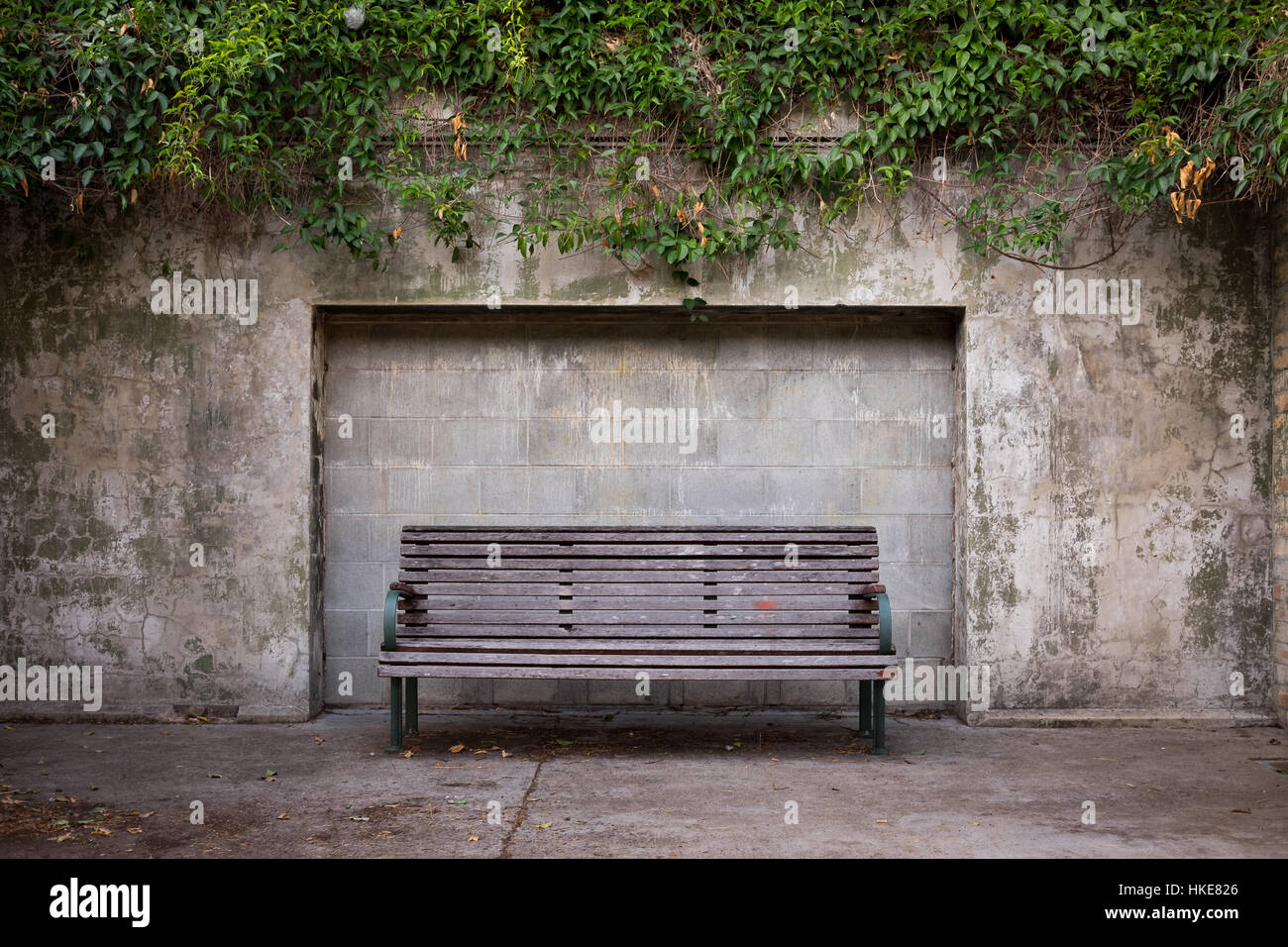 Wooden bench against wall hi-res stock photography and images - Alamy