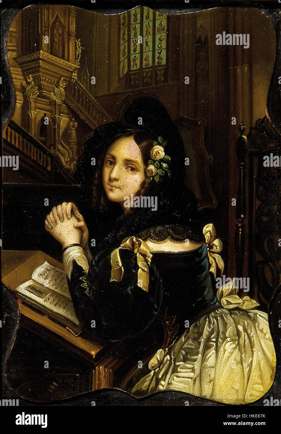 A devotional depiction of a praying woman, captured in a historical oil ...