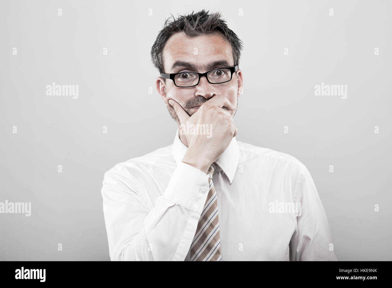 Sceptical accountant with glasses makes a sceptical gesture Stock Photo ...