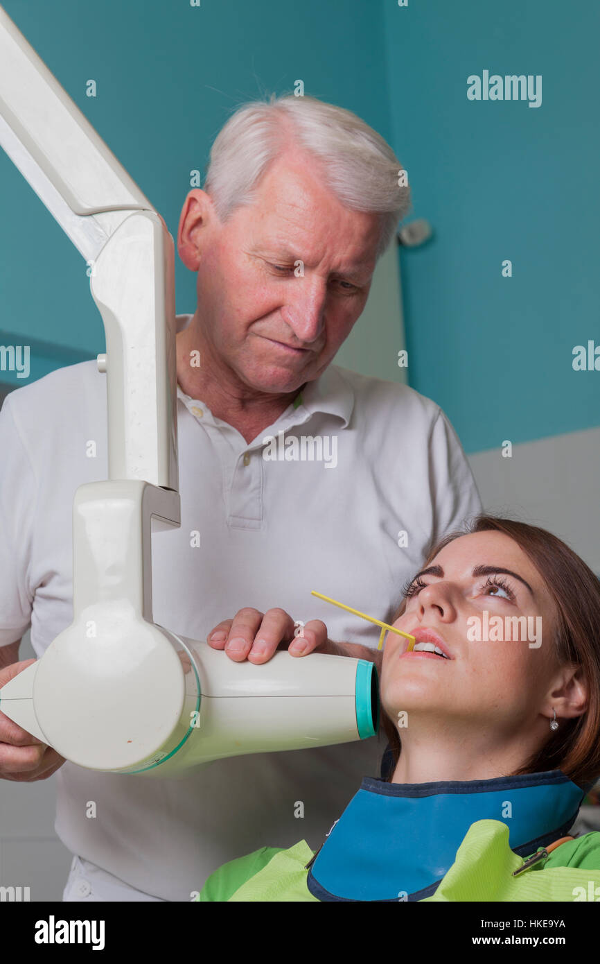 detist arranges x-ray next to orthodont of his female patient Stock ...