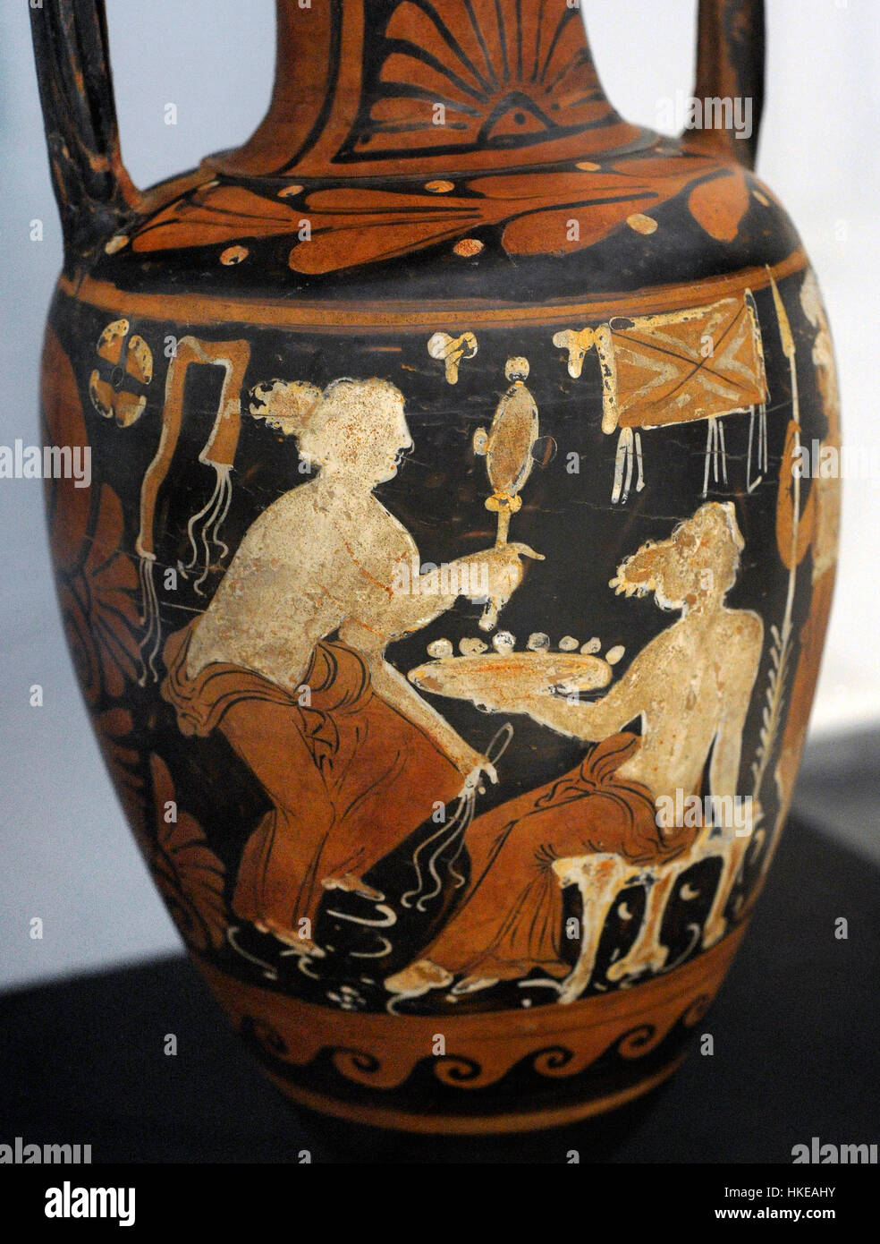 Neck-amphora with red figures decorated with a female figure sitting on ...
