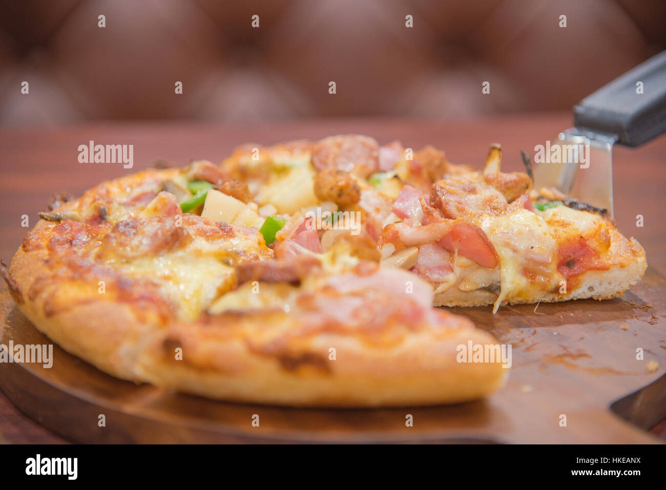Selective Focus On Meat Deluxe Pizza Slice On Pizza Scoop Stock Photo ...