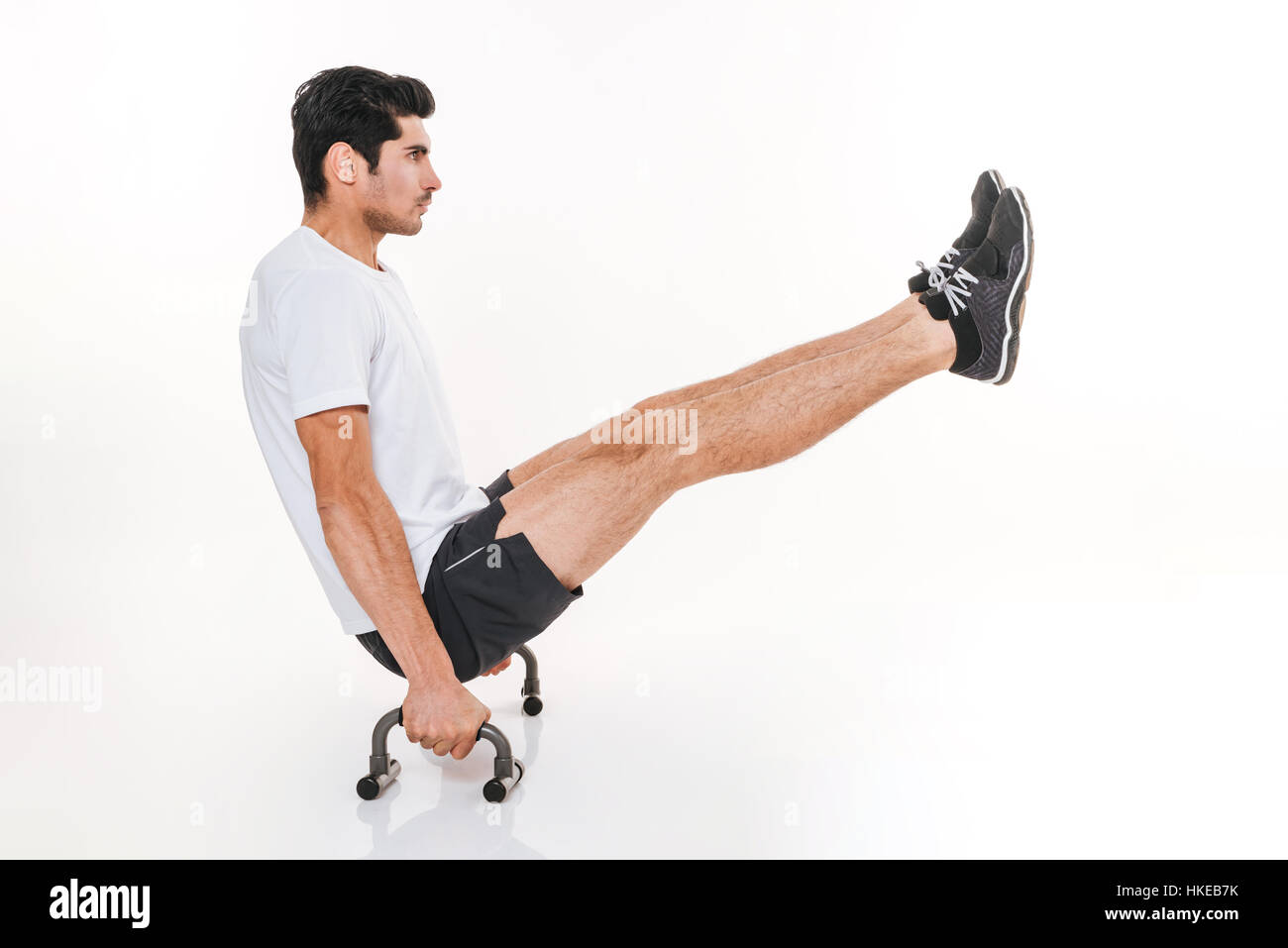 Photo of strong sportsman in gym make sports exercises on floor over ...