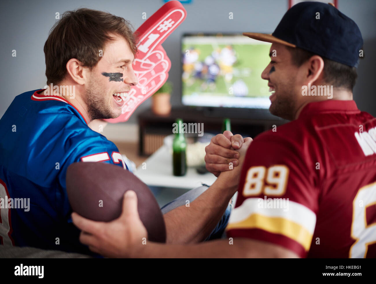 Best mates cherring after their team scores Stock Photo - Alamy