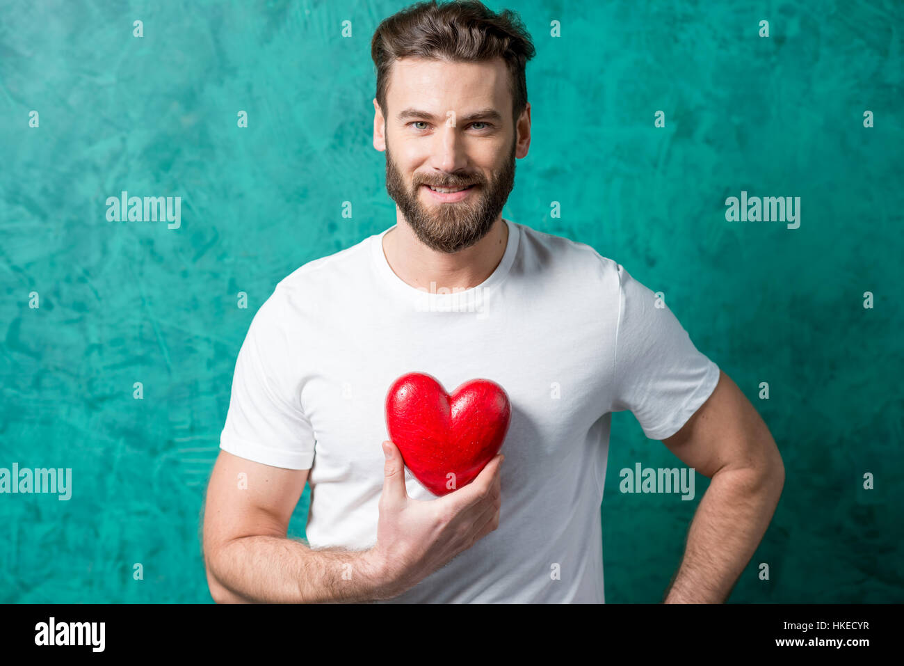 Man with red heart Stock Photo - Alamy