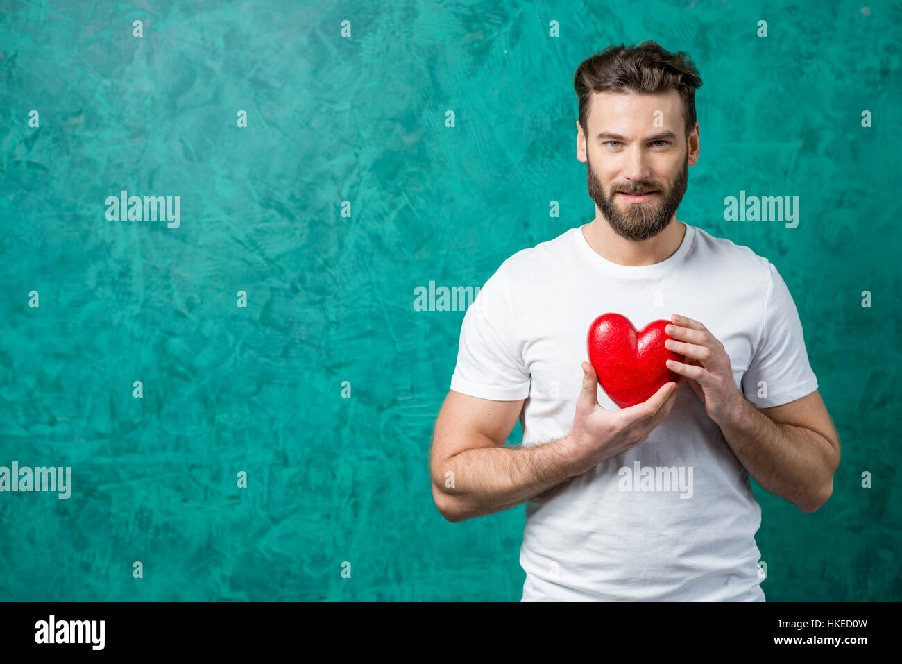 Man with red heart Stock Photo - Alamy