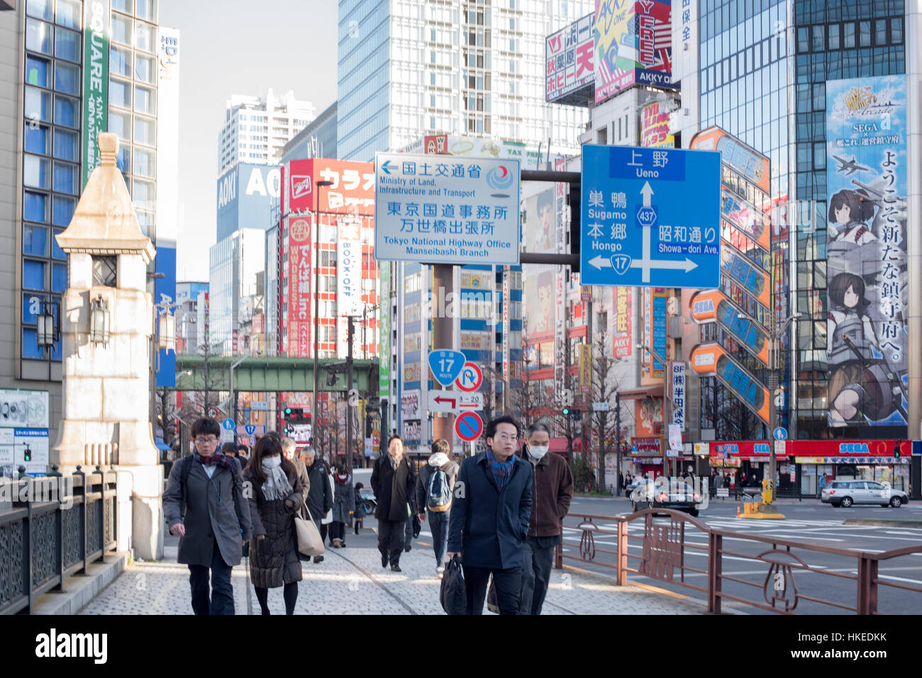 Busy street scene in Tokyo, Japan. People dressed in business suits and ...
