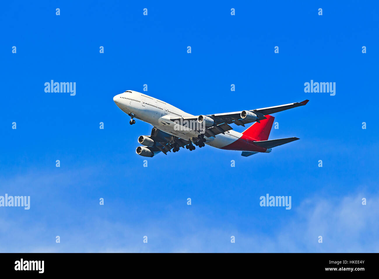 Huge double-decker airplane midair in a blue clear sky elevating from ...