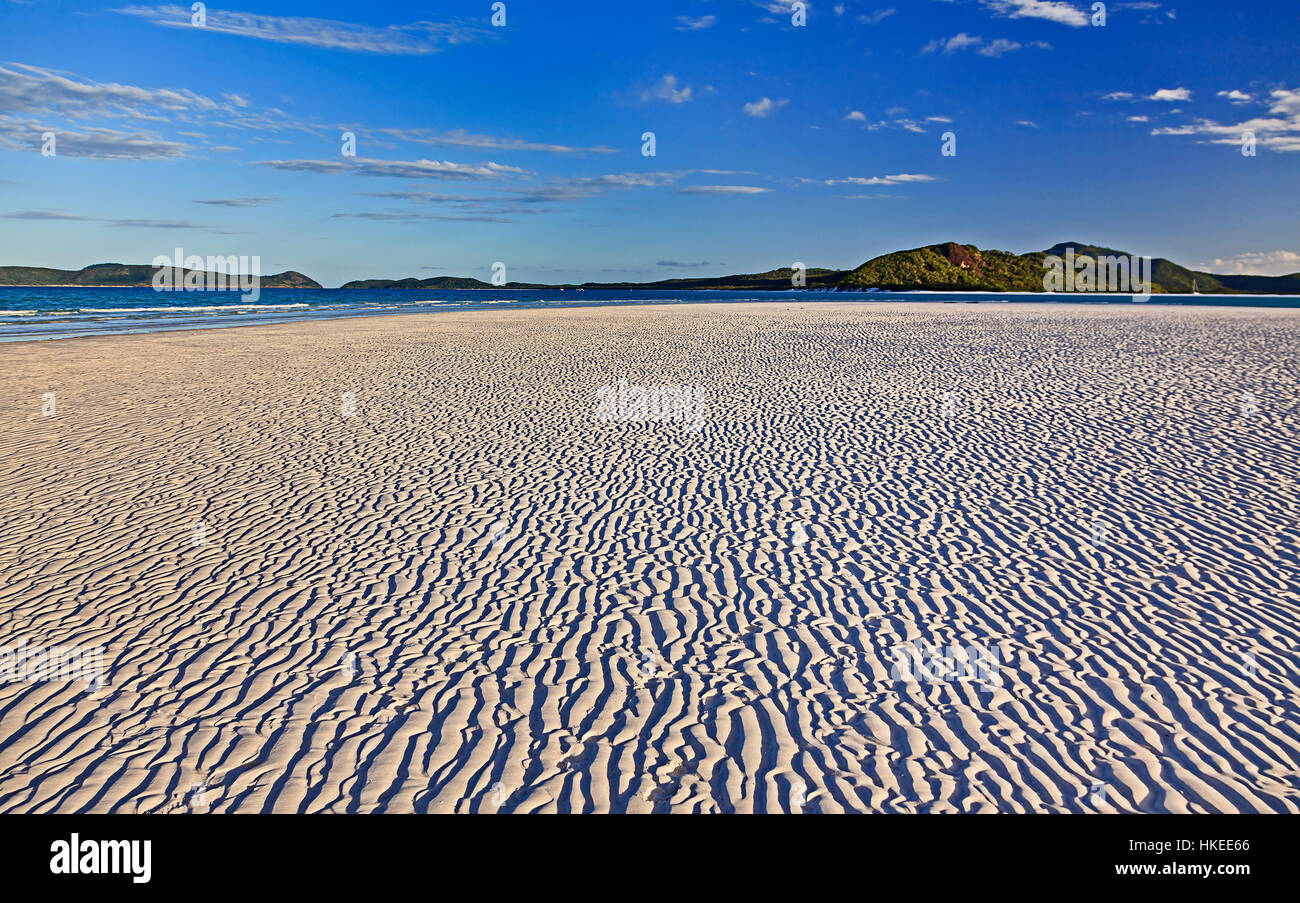 Random light-shade pattern on white silica sandy Whitehaven beach of ...
