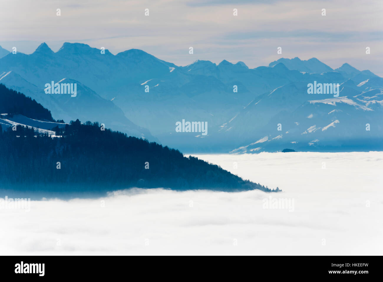 Sunny winter view from Mount Zug (Zugerberg) onto the Swiss alps around ...