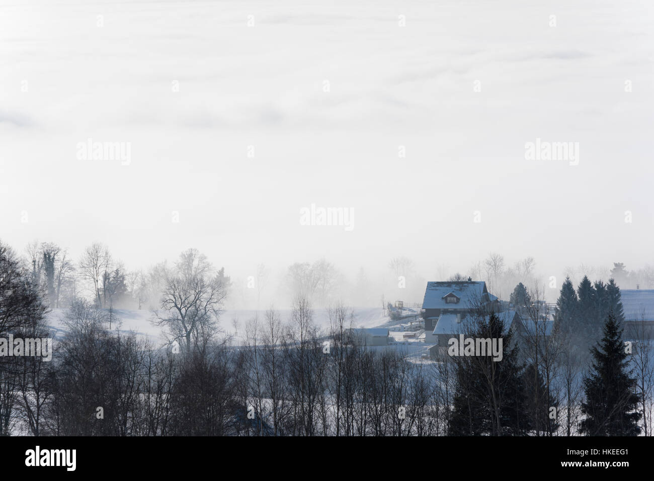 Sunny winter view from Mount Zug (Zugerberg) onto mist and clouds down ...
