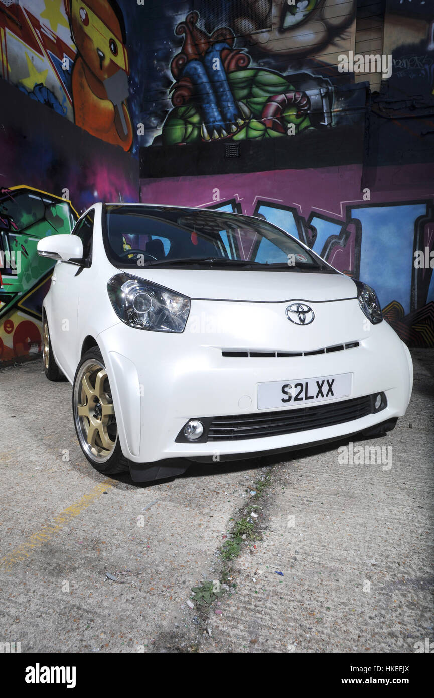 Modified Toyota IQ sub compact city car and graffiti wall Stock Photo ...
