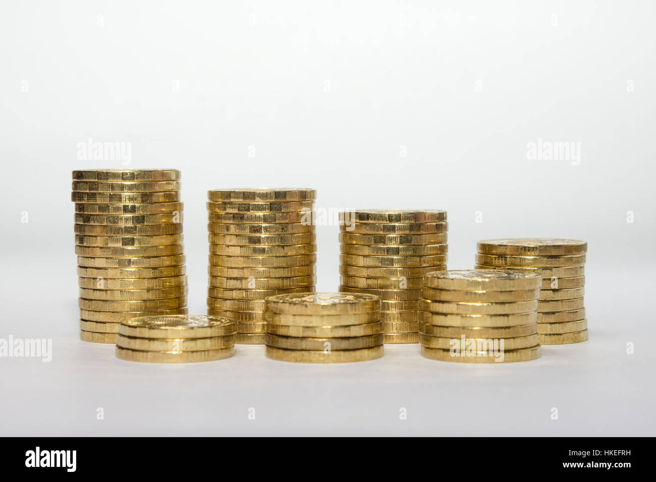 Seven coins columns mounted in two rows showing savings growth Stock ...
