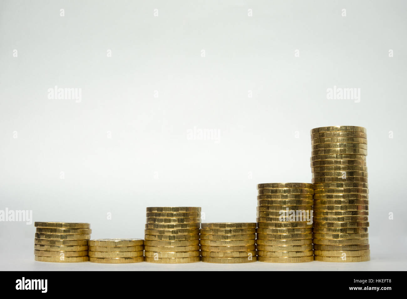 Six stacks of coins showing uneven growth of profitability Stock Photo ...