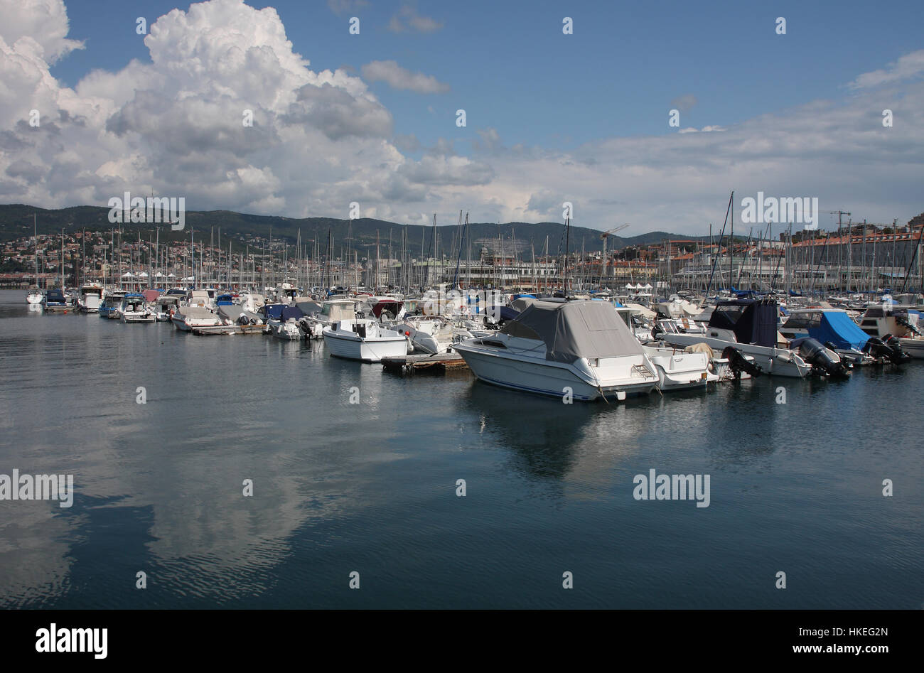 Motor boats and sailboats in harbor in Trieste, Italy on a summer day ...