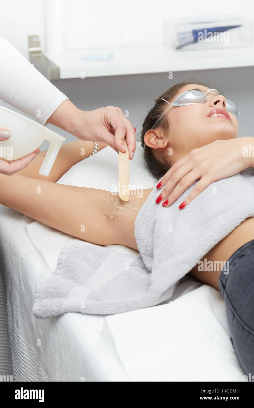 woman at cosmetics salon, legs underarm mustache laser epilation Stock ...