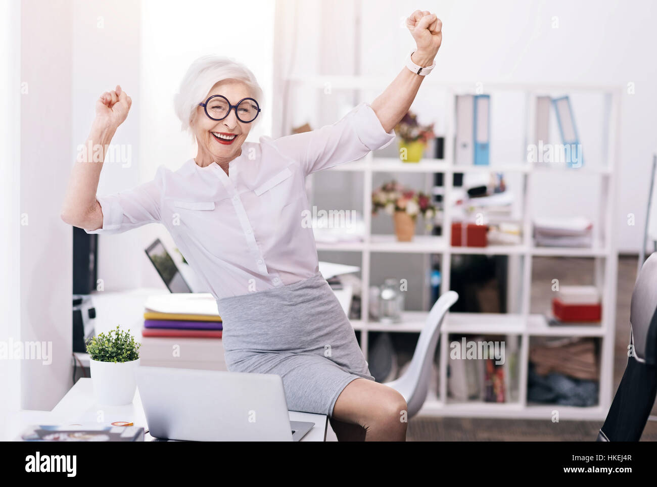 Glad happy business lady expressing joy at the workplace Stock Photo ...