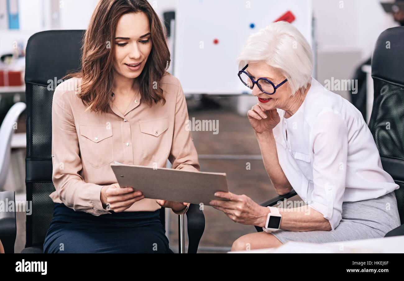 Involved business partners discussing the project in the office Stock Photo - Alamy