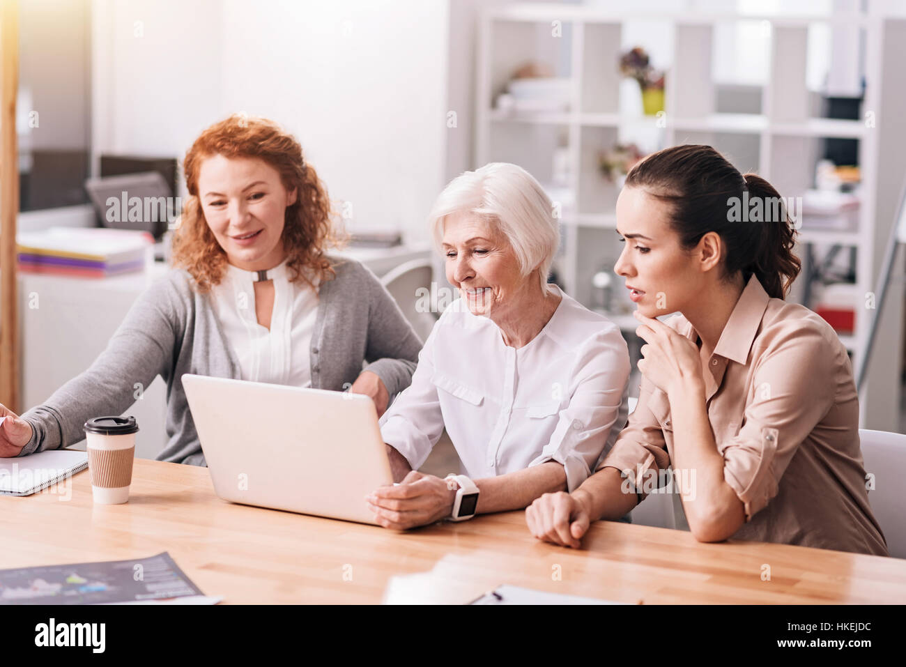 Hardworking involved colleagues collaborating in the office Stock Photo ...