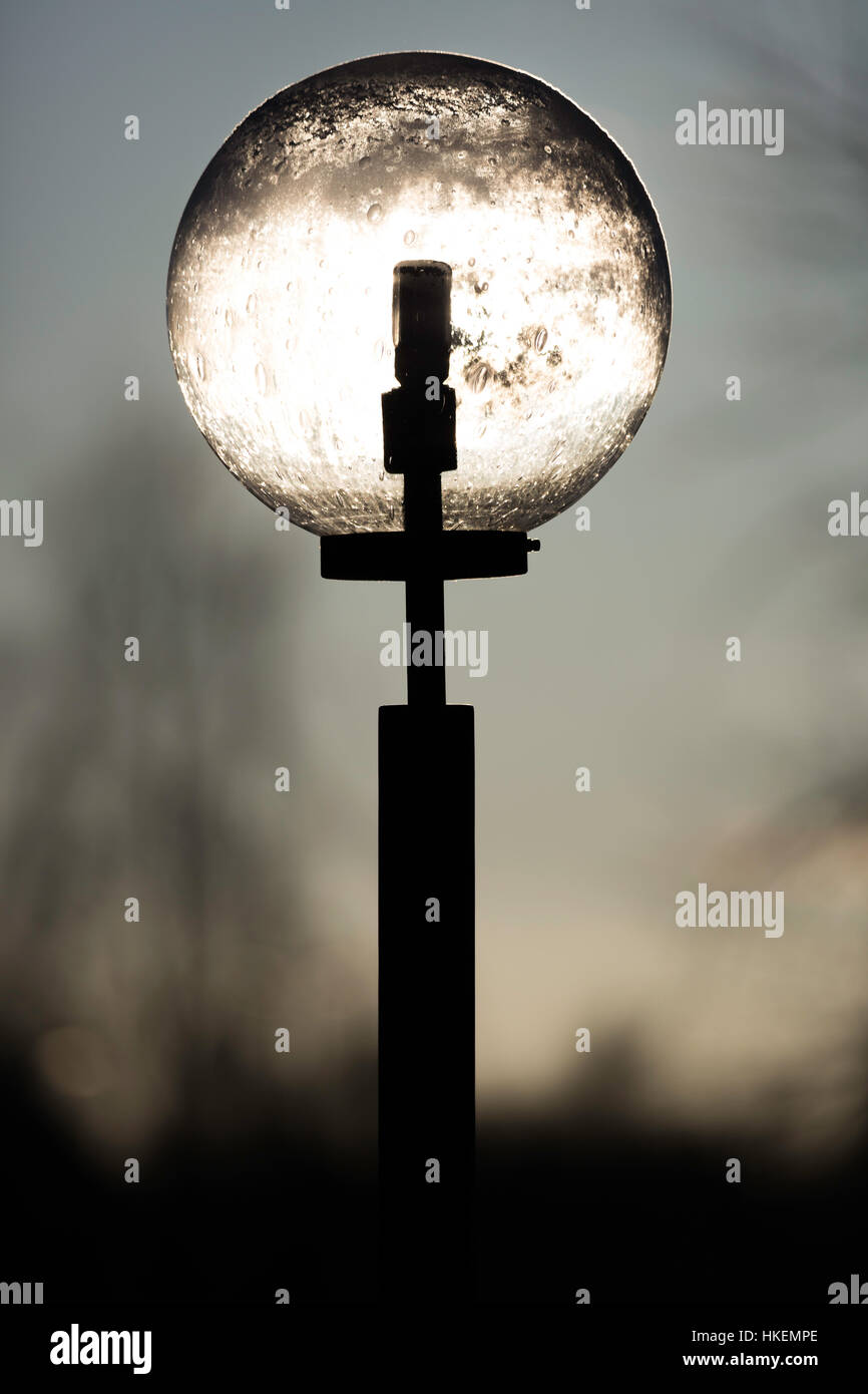 Sun Light Shining through Street Light Stock Photo - Alamy