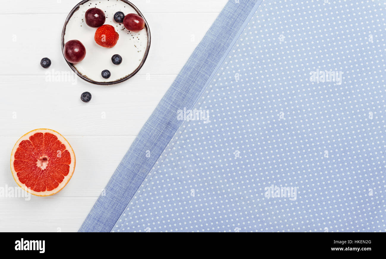 Breakfast table decorated with blue cloth Stock Photo - Alamy