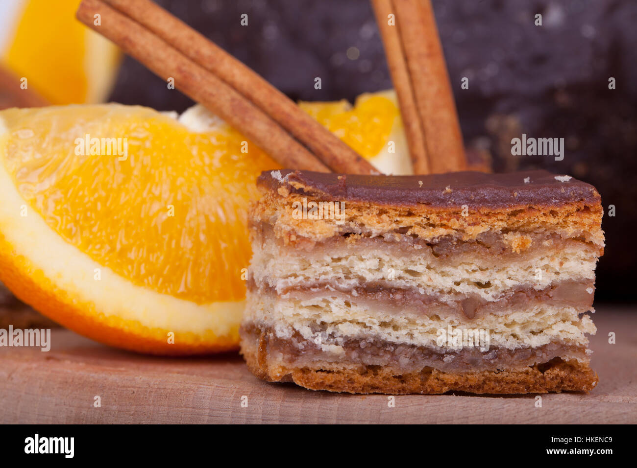 Very tasty chocolate cake with orange on a wooden base Stock Photo - Alamy
