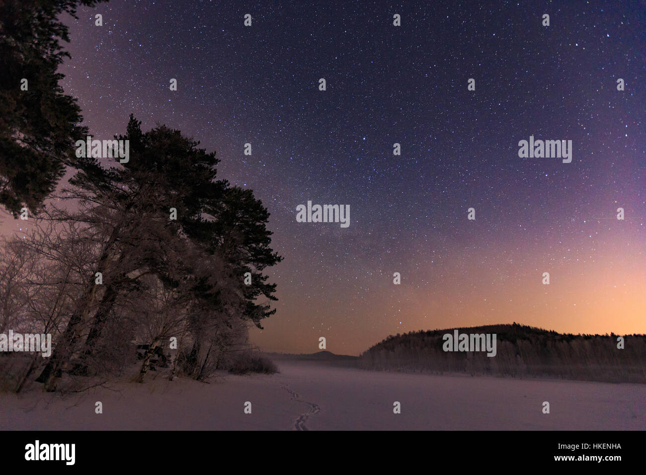 night sky in forest, frozen lake with night stars sky, russian winter ...