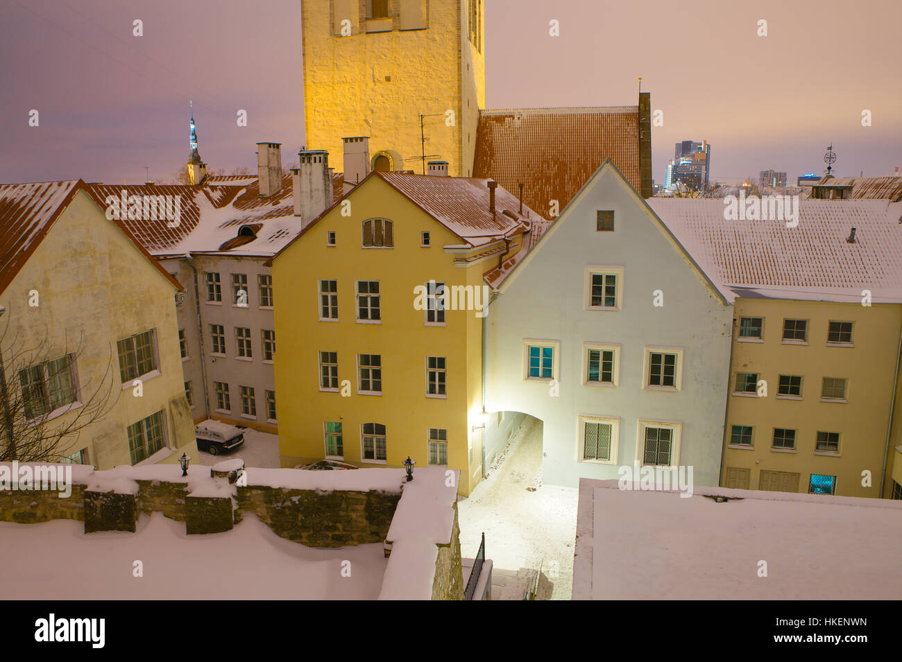 Snow covered roofs of cosy medieval building in old town of Tallinn ...