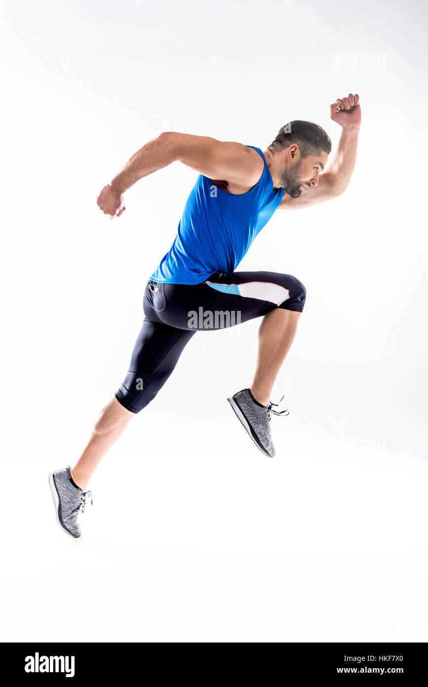 Athletic man running Stock Photo - Alamy