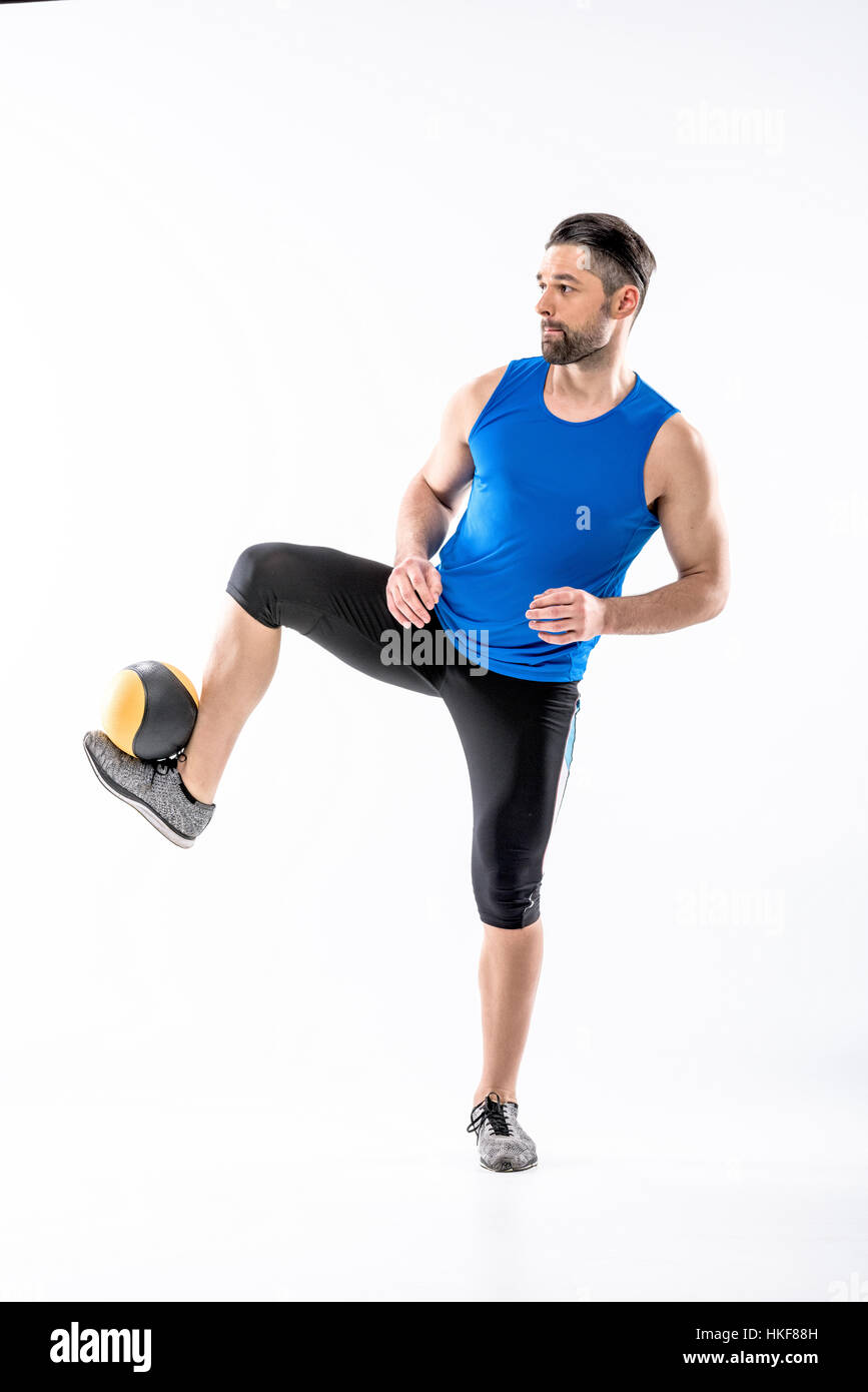 Man exercising with ball Stock Photo - Alamy