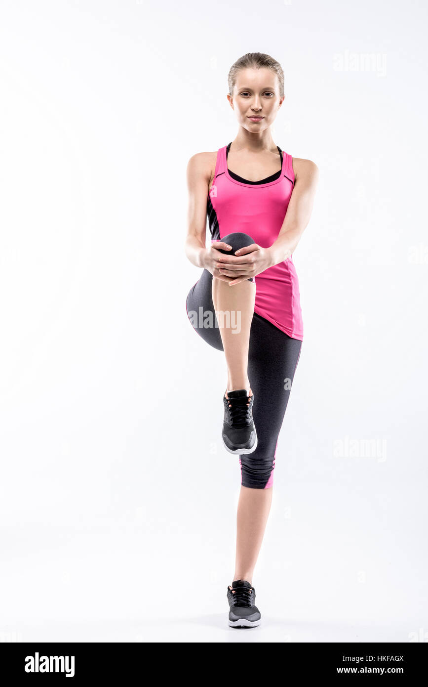 Young woman stretching Stock Photo - Alamy