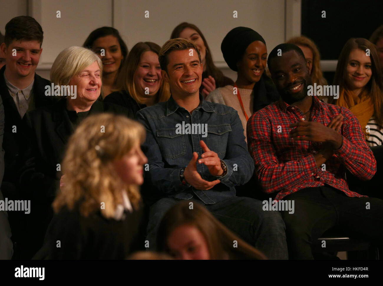 Orlando Bloom and Paapa Essiedu listen to Patsy Rodenburg whilst ...