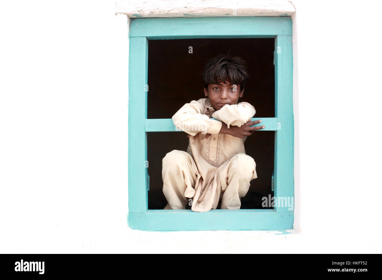 Boy holding window Stock Photo - Alamy