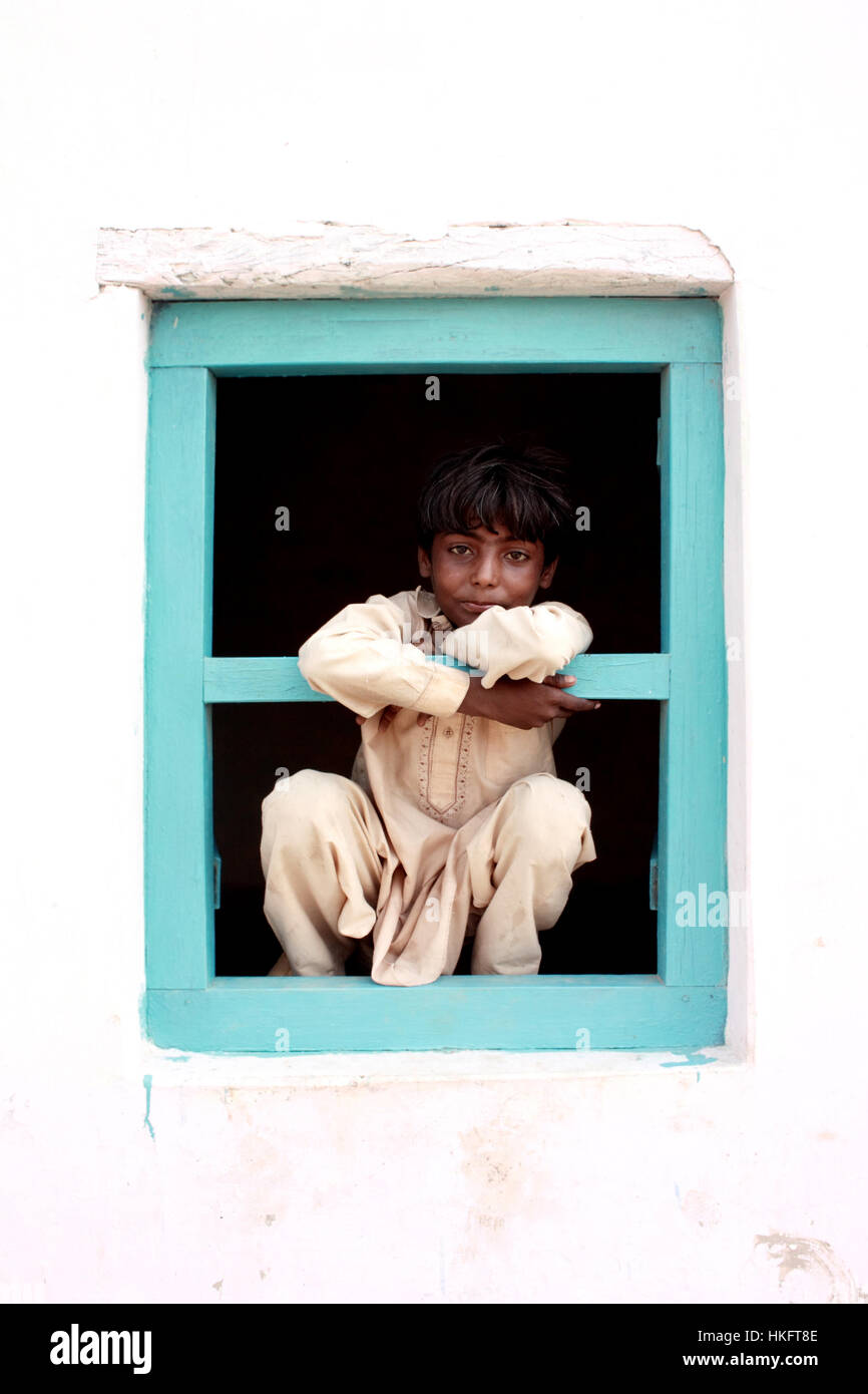 Boy holding window Stock Photo - Alamy