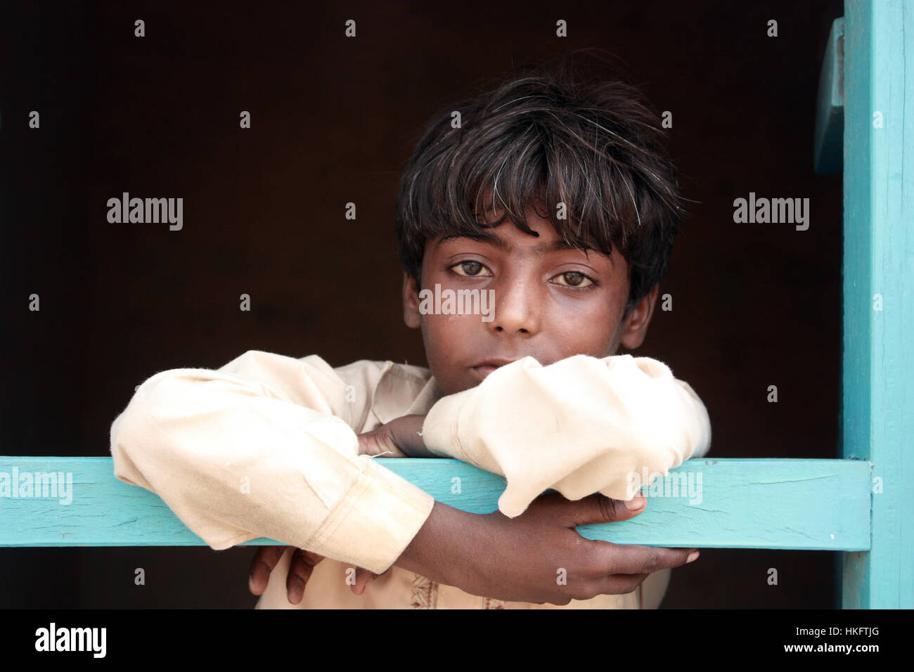 Boy holding window Stock Photo - Alamy