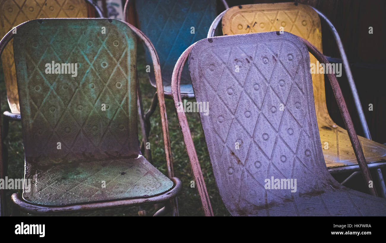 Colourful vintage retro metal chairs Stock Photo - Alamy