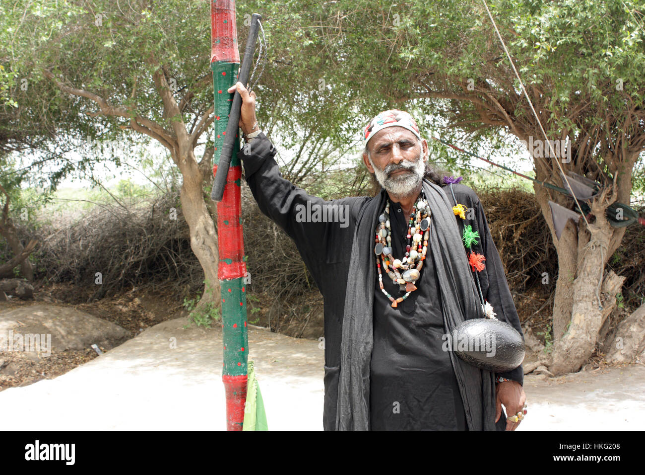 Pakistani Beggar wearing necklace Stock Photo - Alamy