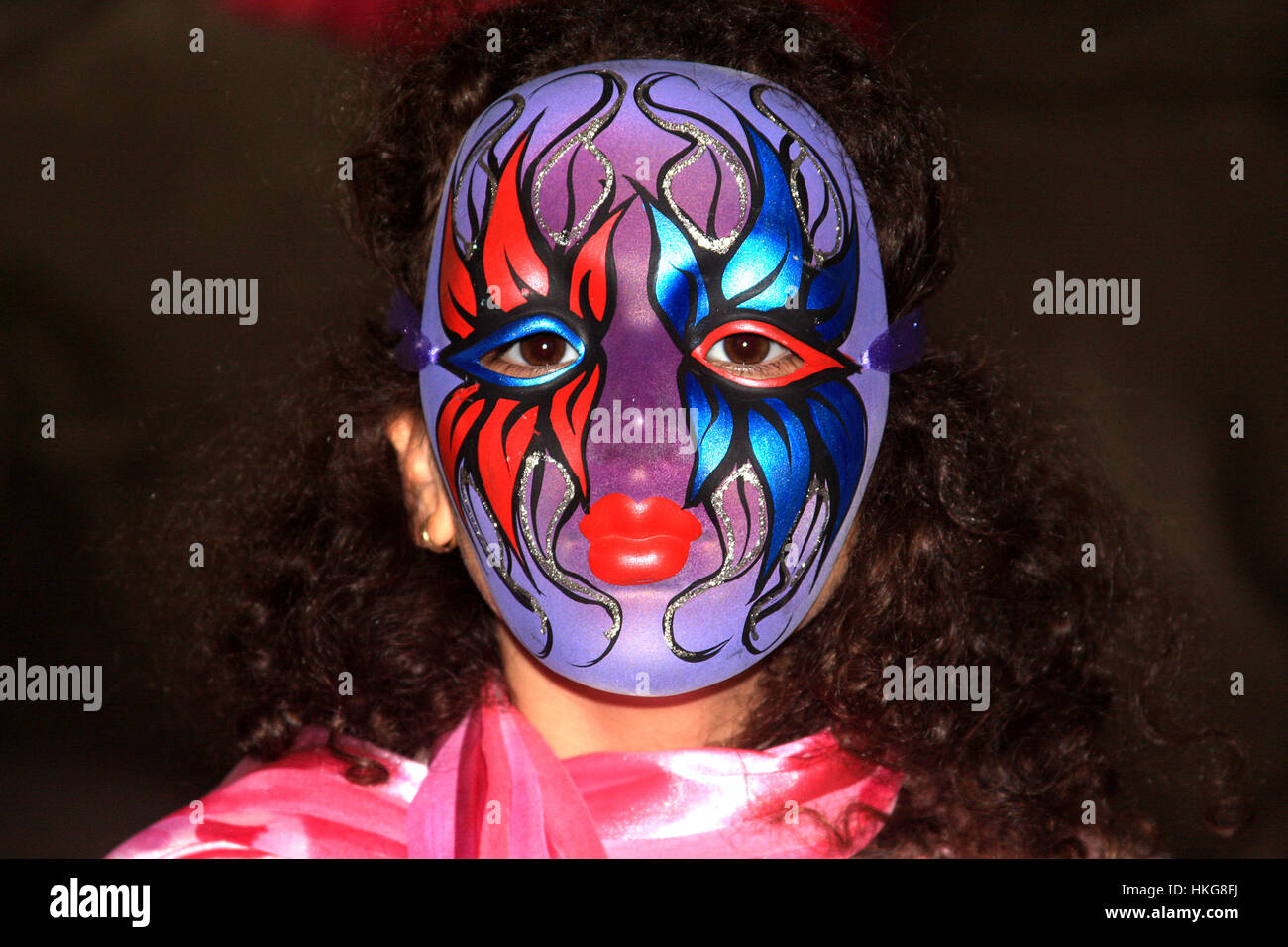 Little girl wearing a clay mask Stock Photo - Alamy