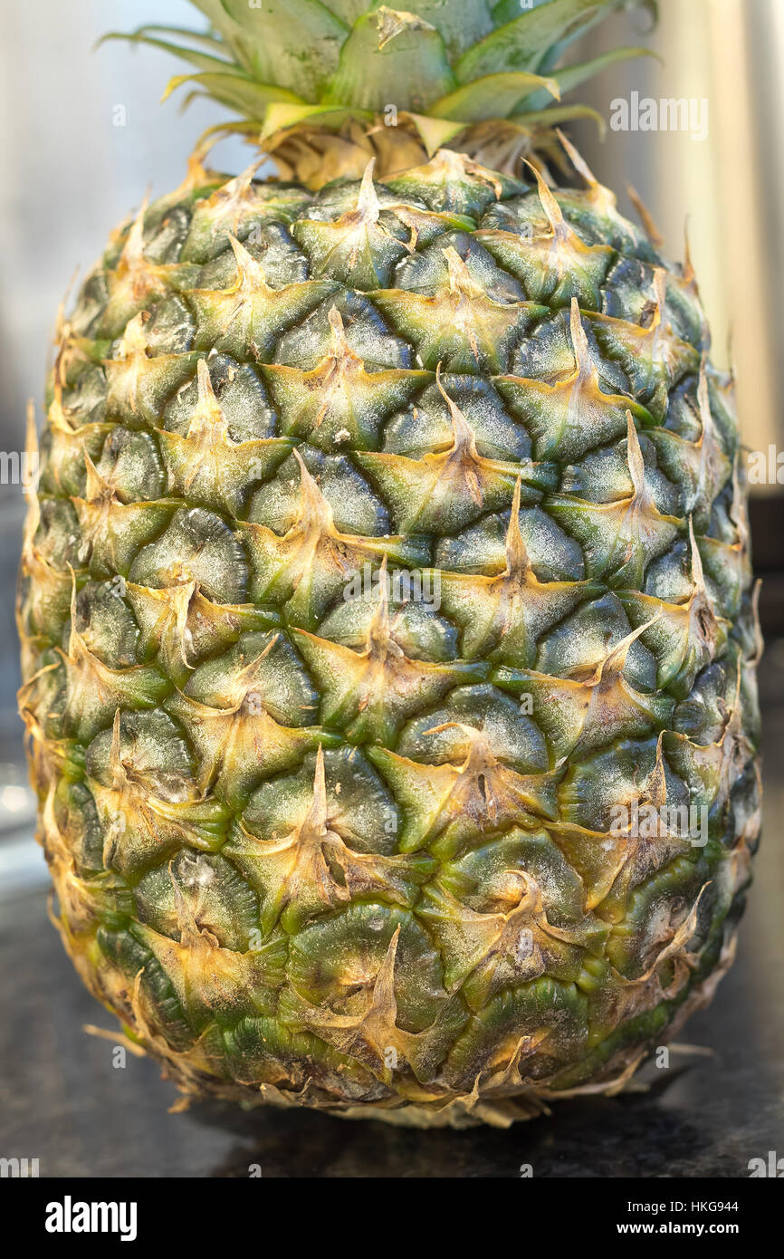 A closeup on a full green and yellow pineapple Stock Photo - Alamy