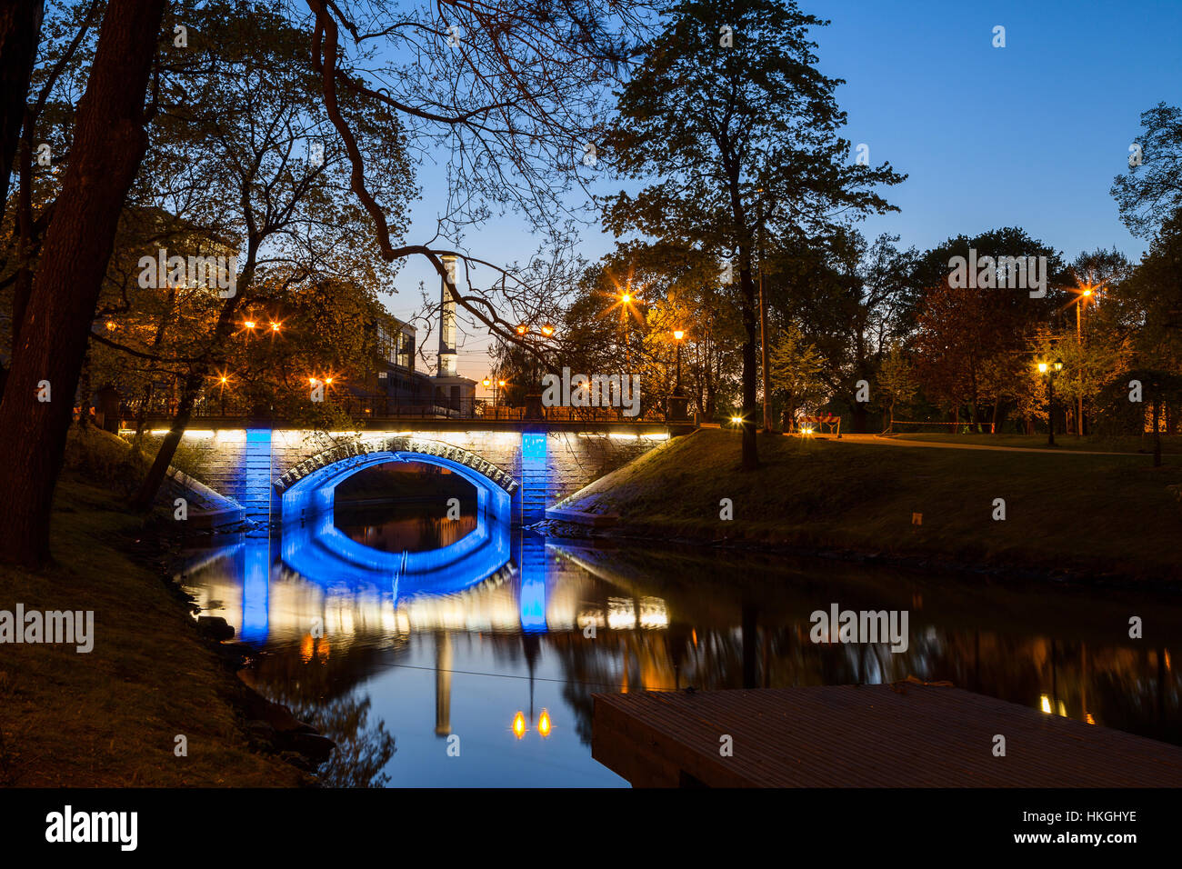 Small blue color illuminated bridge at night. Old European city Stock ...