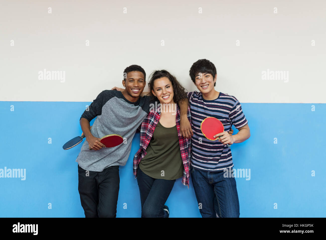 Diverse friends playing tennis hi-res stock photography and images - Alamy
