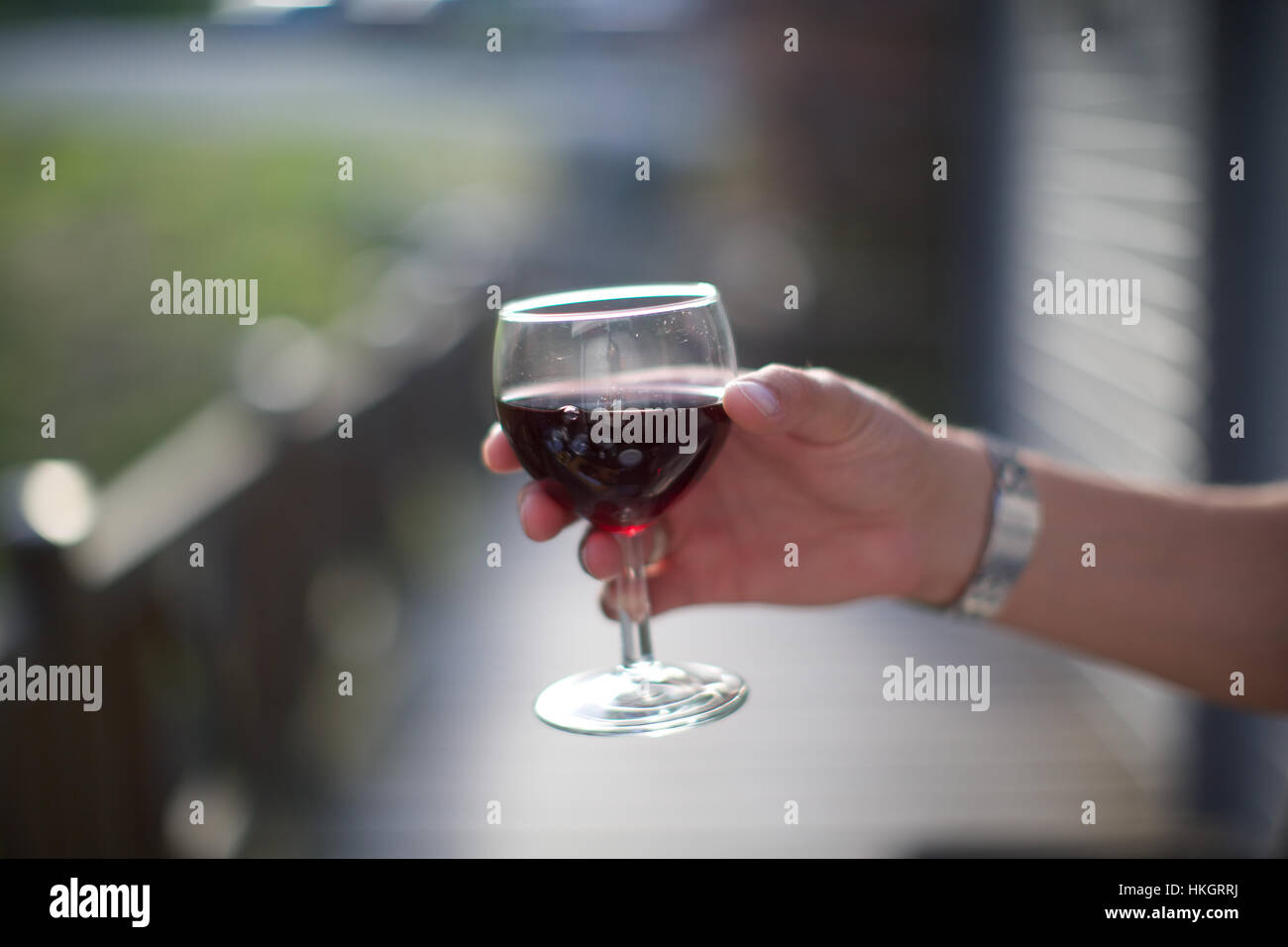 Hand holding glass wine hi-res stock photography and images - Alamy