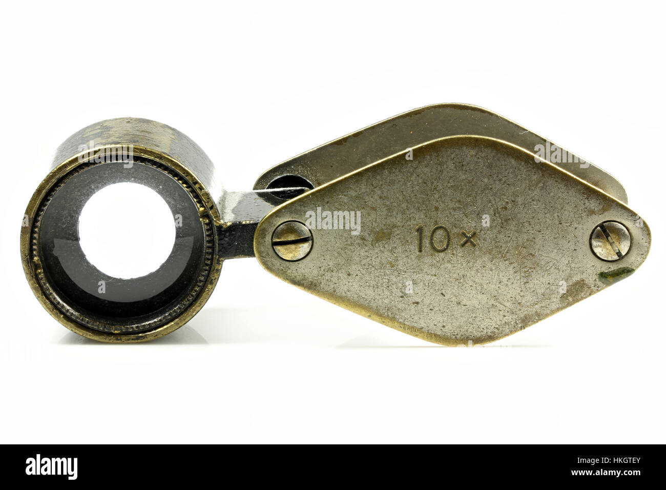 vintage folding magnifier with 10x magnification isolated on white ...