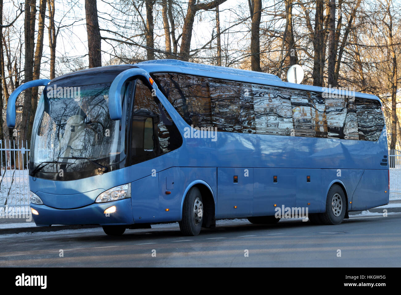 Modern blue bus is on the edge of the road Stock Photo - Alamy