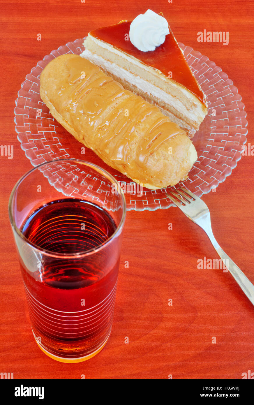 Sweet cake and eclairs closeup Stock Photo - Alamy